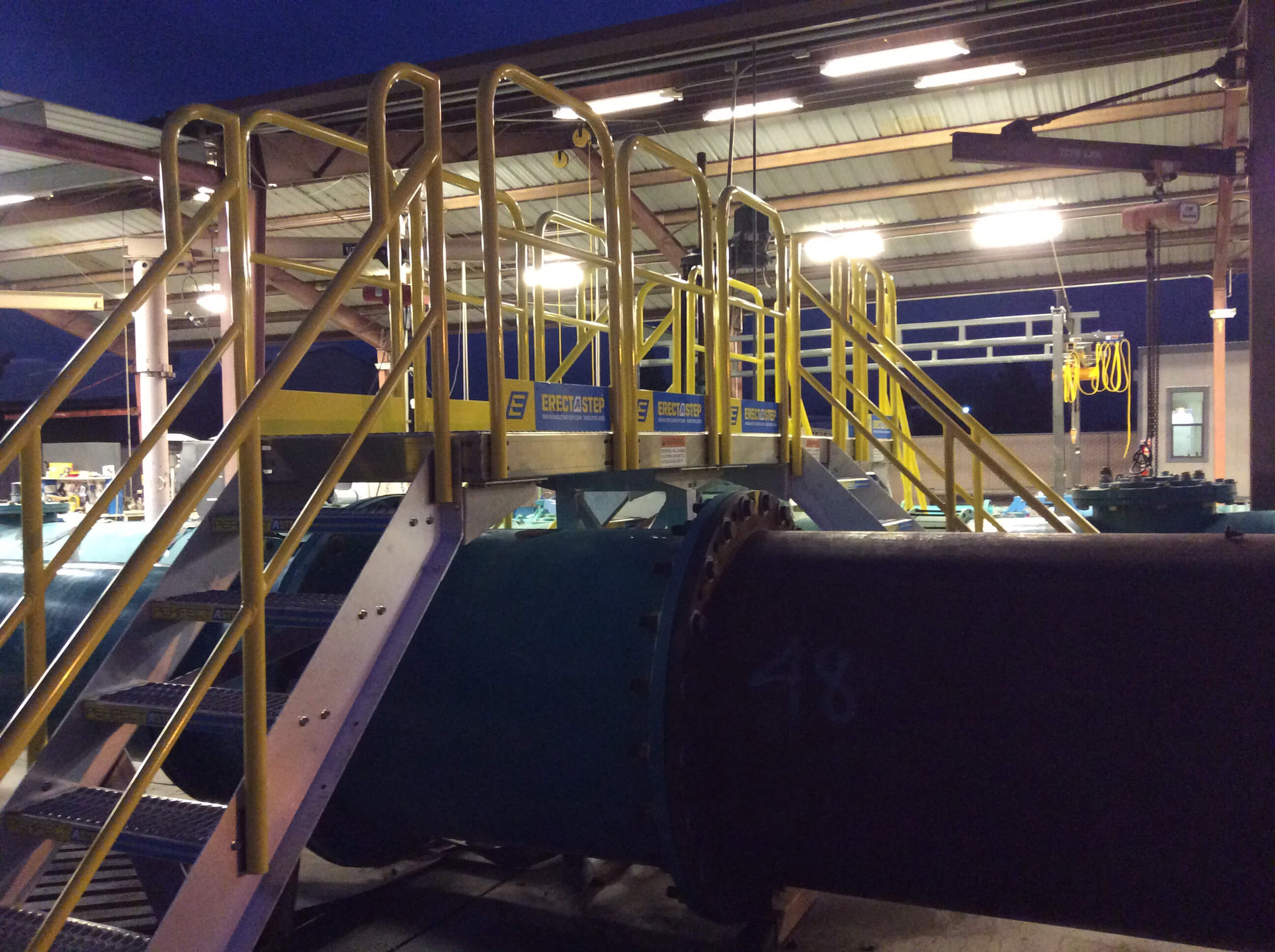 Erectastep industrial crossover stairs in Porterville facility - ErectaStep